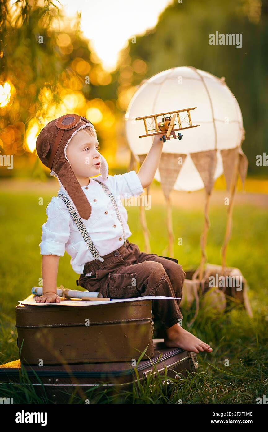 A little boy dreams of becoming a pilot. Vintage aviation hat Stock ...