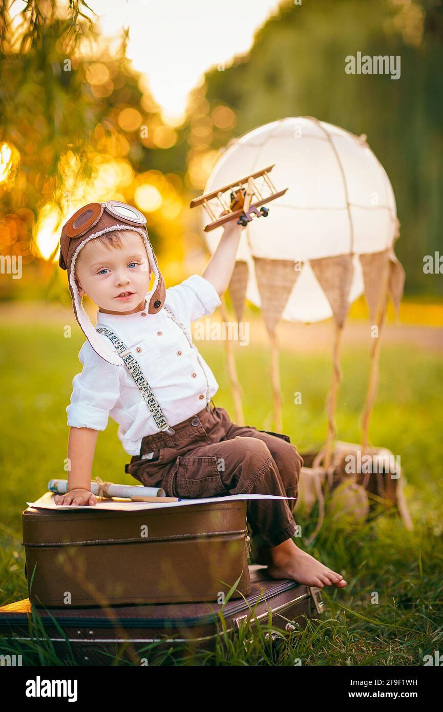 A little boy dreams of becoming a pilot. Vintage aviation hat Stock ...