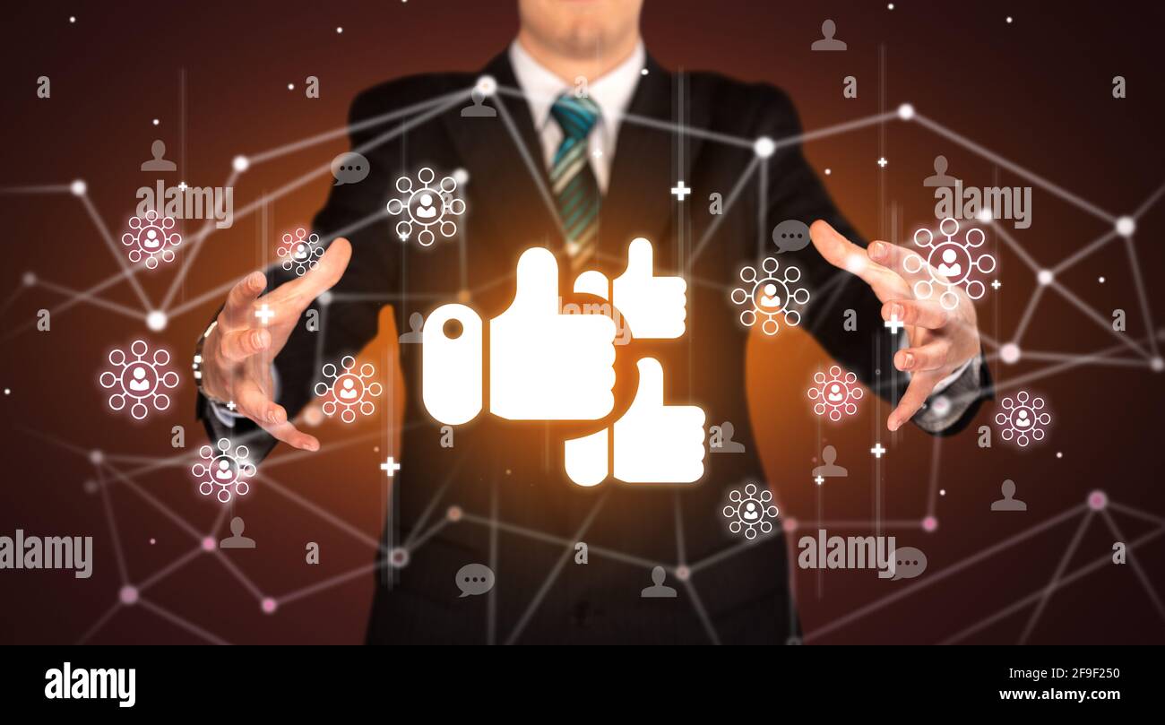Hand holding social media icons Stock Photo - Alamy