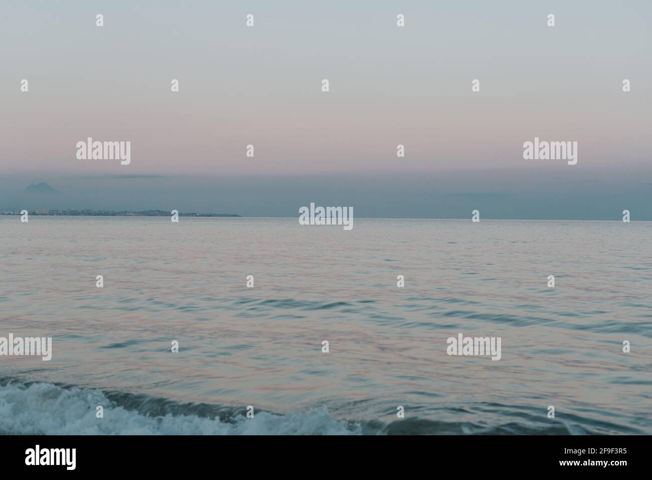 A beautiful scenery of a calm sea at sunset Stock Photo - Alamy
