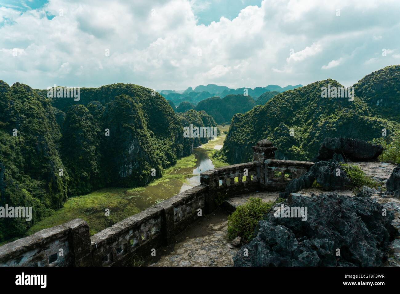 A landscape of Hang Mua covered in hills and greenery under the ...