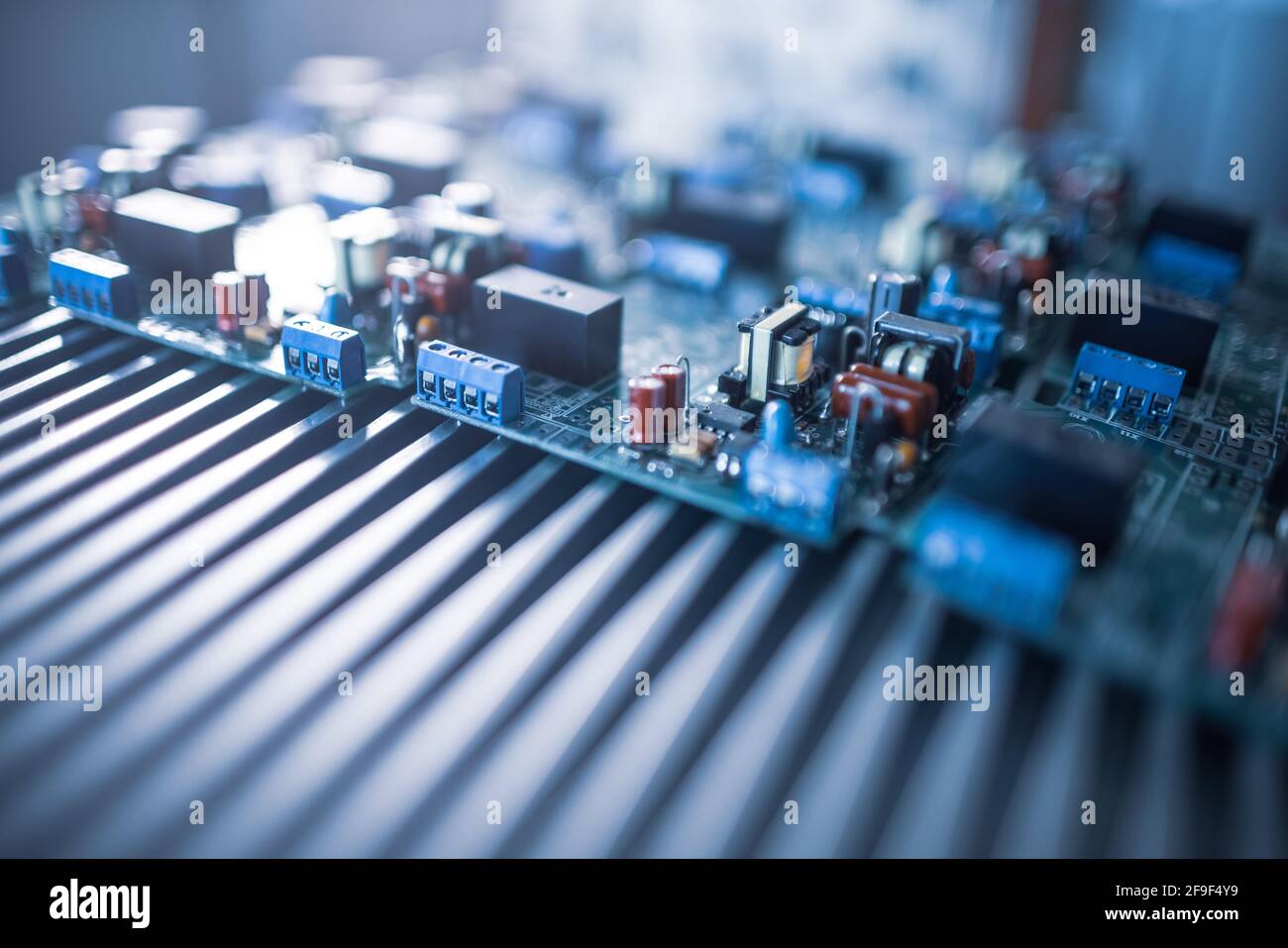 Microcircuits and components lie on metal plates Stock Photo - Alamy