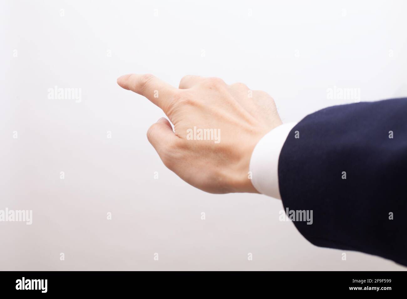 A businessman's hand pushing a button with his index finger Stock Photo ...