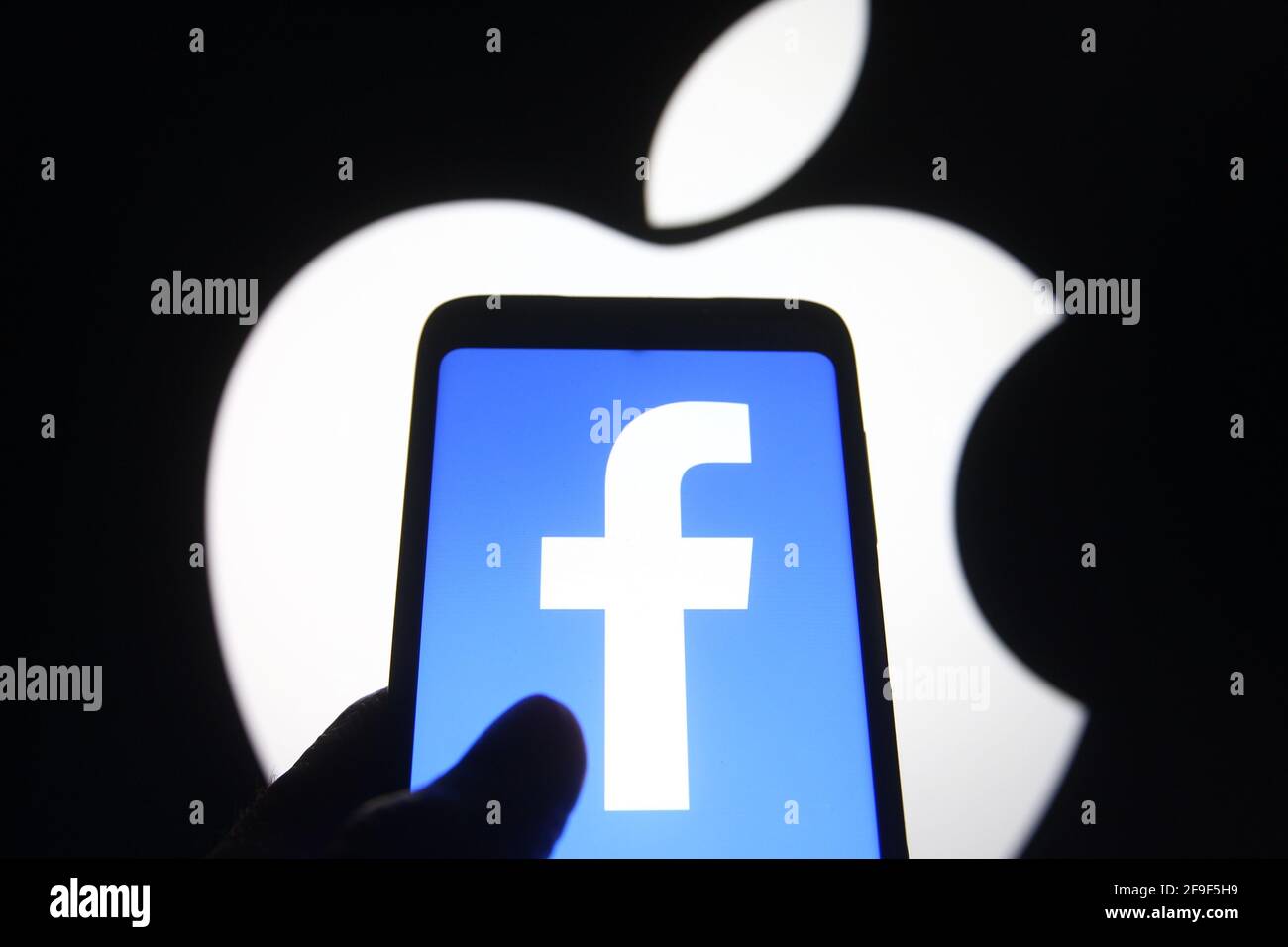 In this photo illustration, the Facebook logo seen displayed on a ...