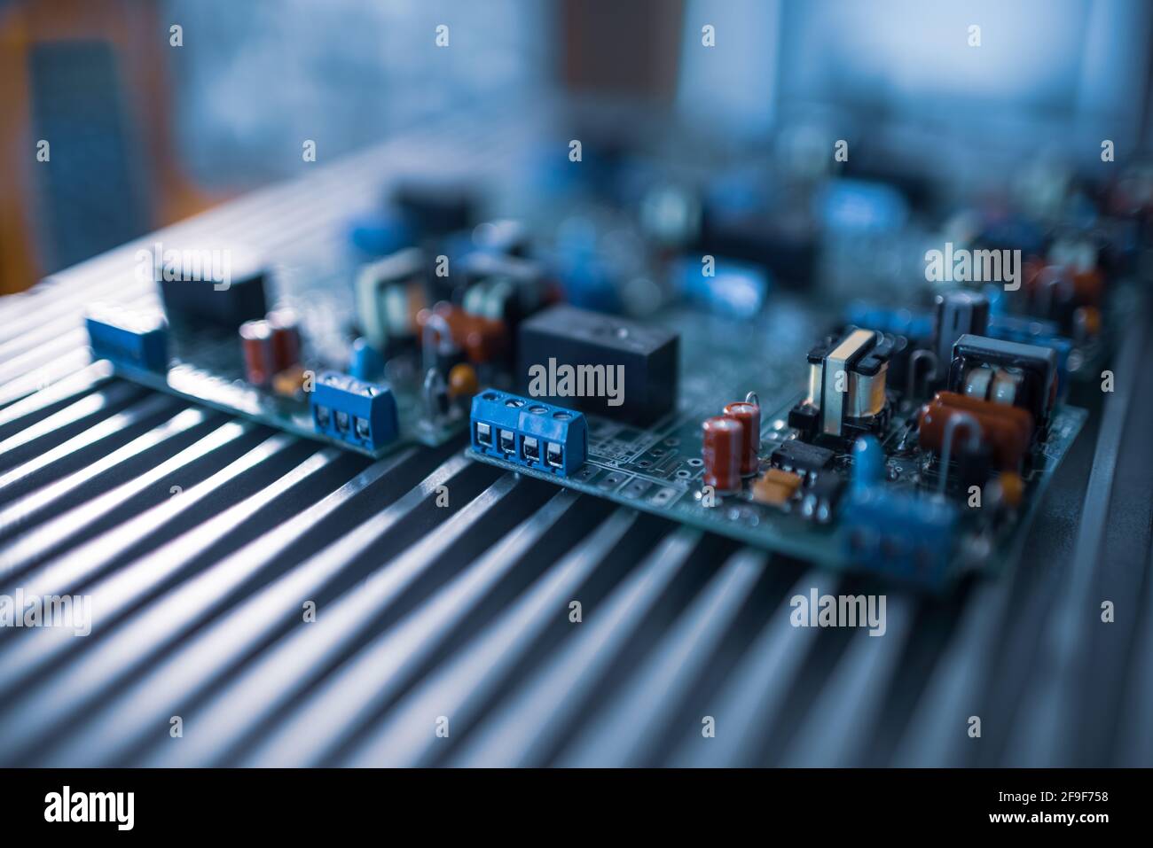 Microcircuits and components lie on metal plates Stock Photo - Alamy