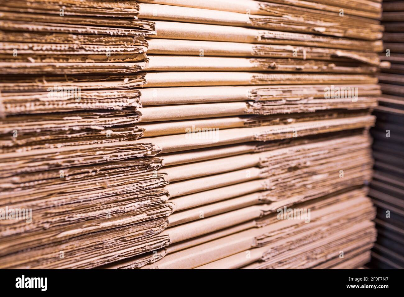 Close-up sides of stacks of cardboard folded Stock Photo - Alamy