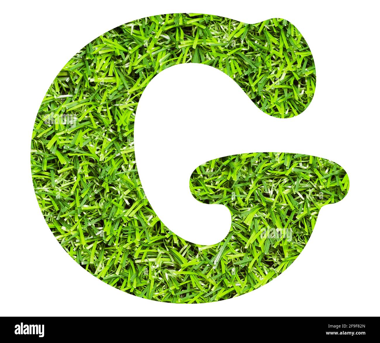 Letter G - Artificial green grass background Stock Photo - Alamy