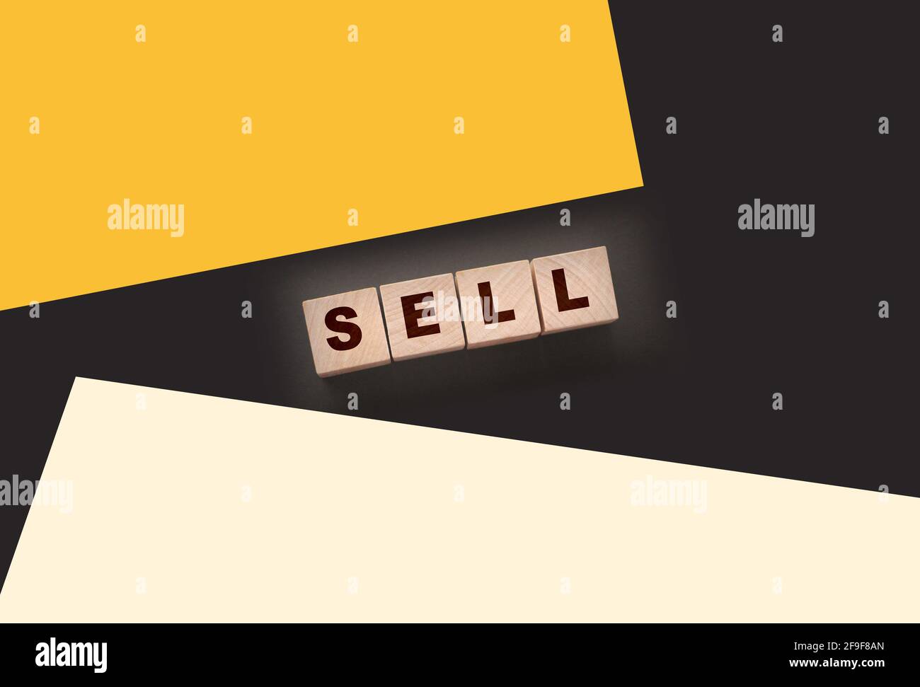 Wooden cubes with word sell on the dark background. Shopping concept ...