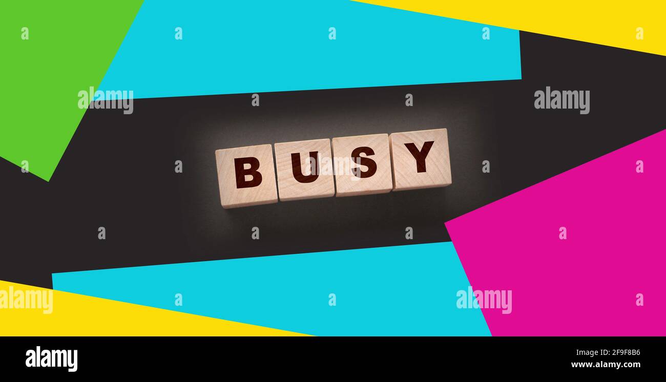 Word Busy made with cube wooden blocks. Business career concept Stock ...