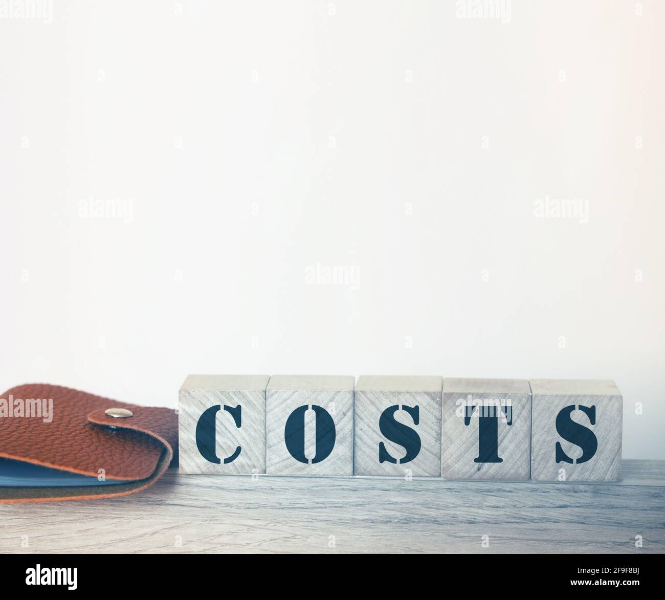 Cost, expense or company profit and loss concept, cube wooden block ...