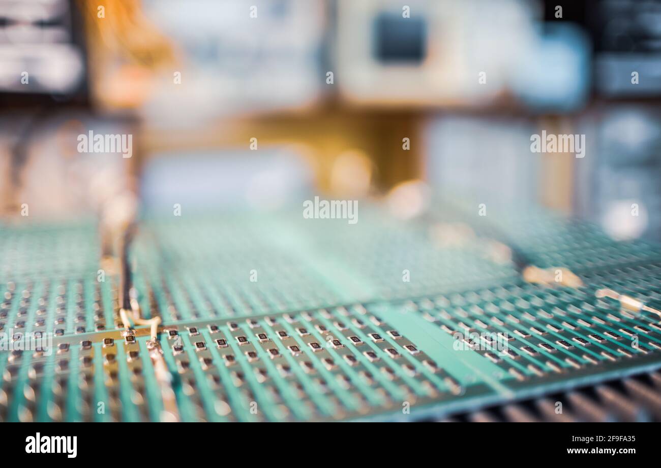 Microcircuits and components lie on metal plates Stock Photo - Alamy