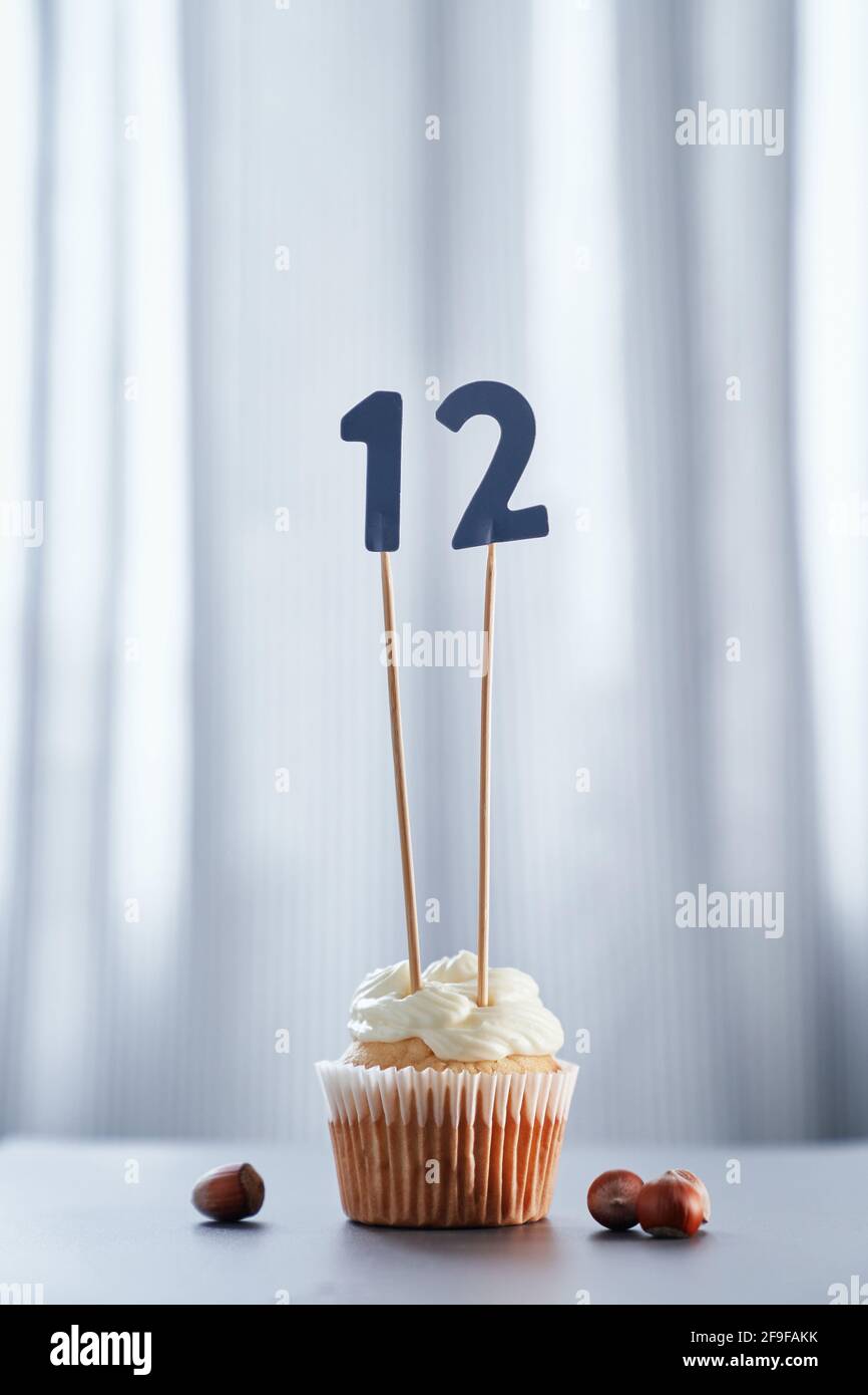 Fresh tasty homemade creamy cupcake or muffin with creamy topping and ...