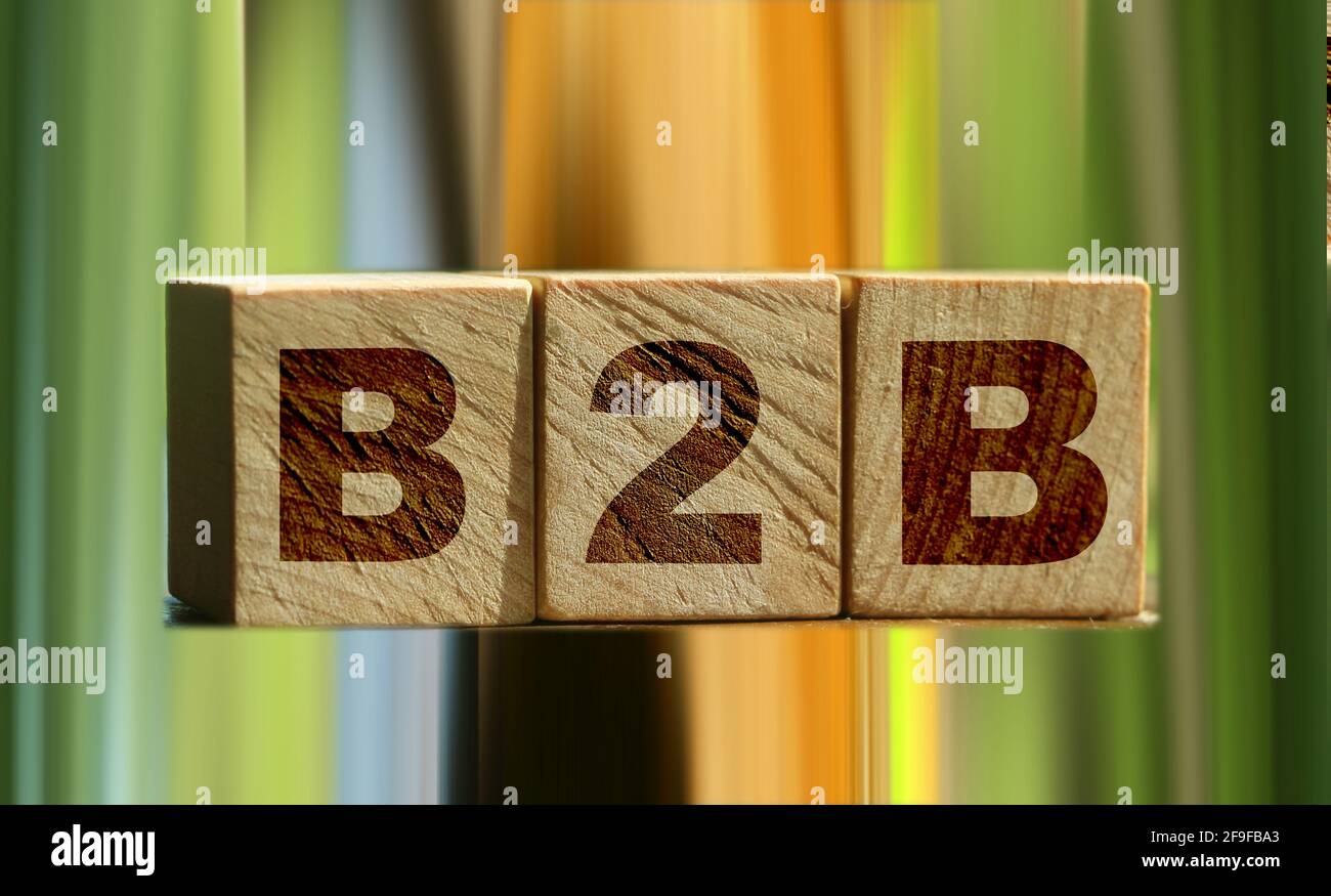 B2C letters on wooden cubes put on wooden table standing outdoors ...