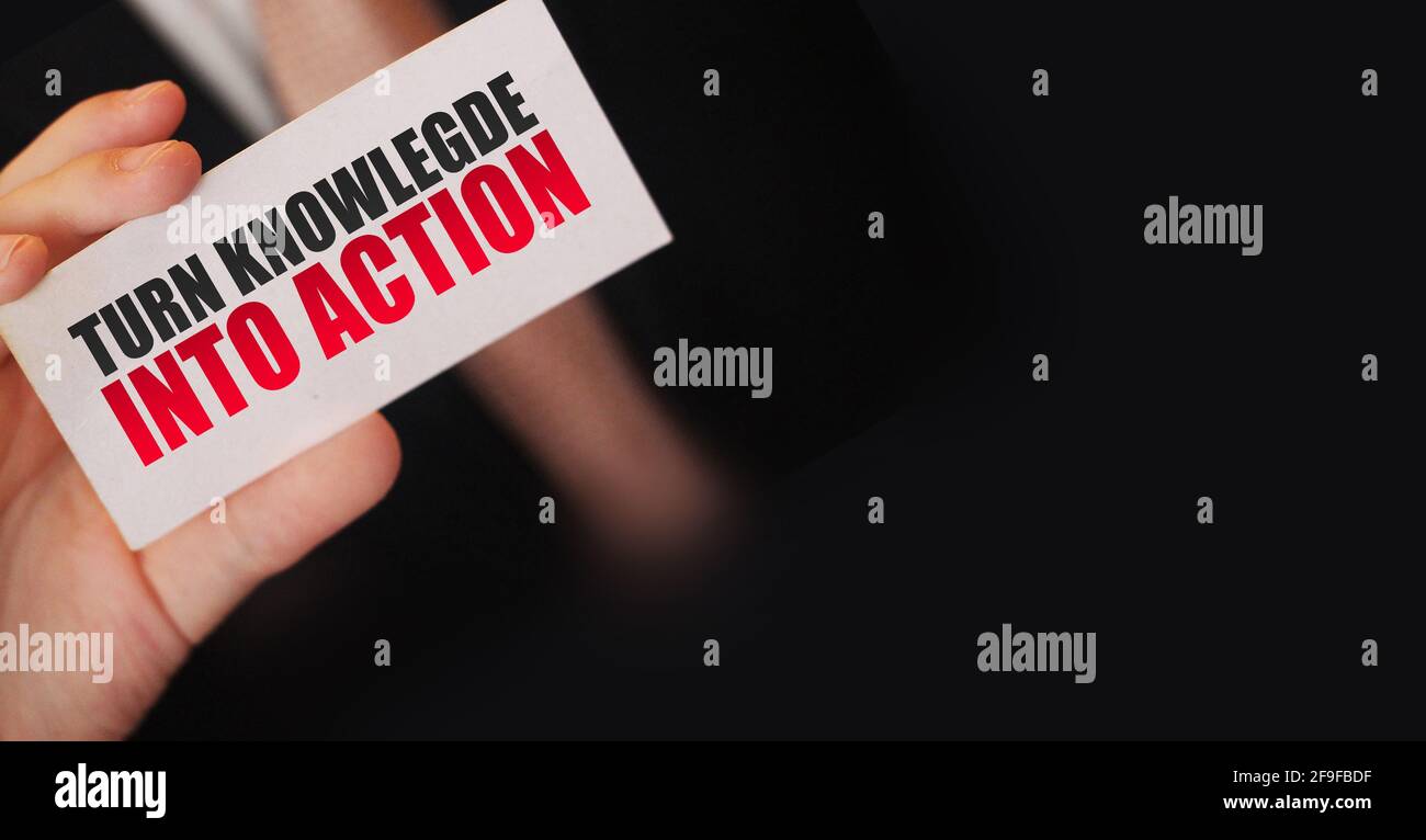Turn Knowledge Into Action card in businessman hand. Business concept ...