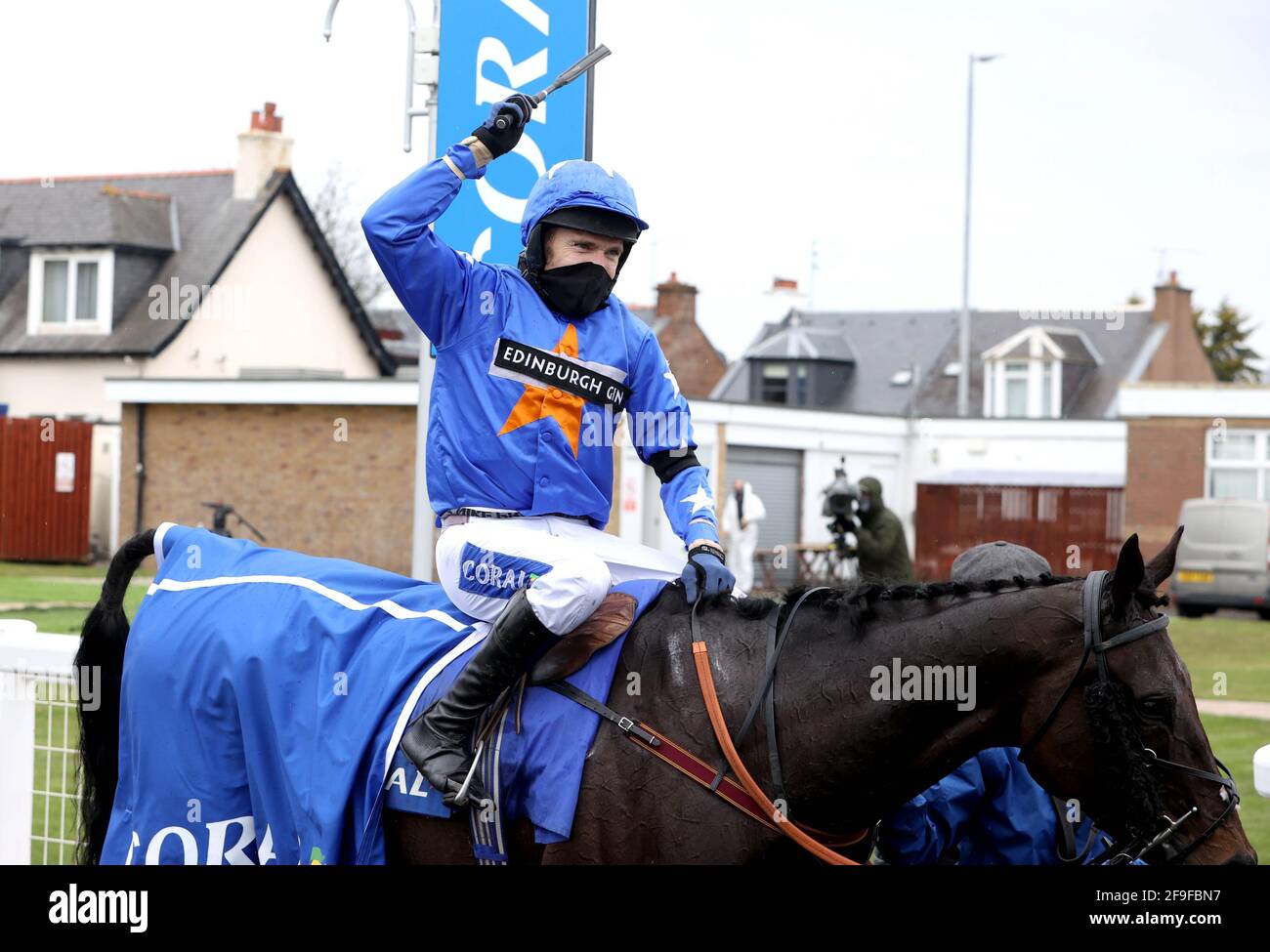 Tom Scudamore celebrates in the parade ring on top of Mighty Thunder ...