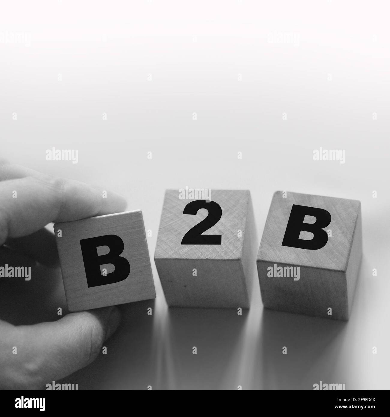 B2B abbreviation in letters on wooden cubes. Business to Busness ...