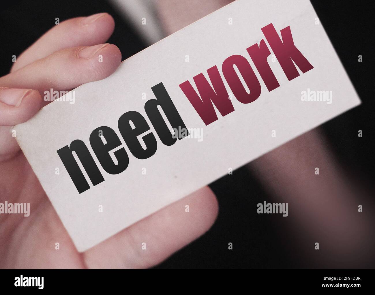 Need work text on card businessman holds. Qualified unemployed ...