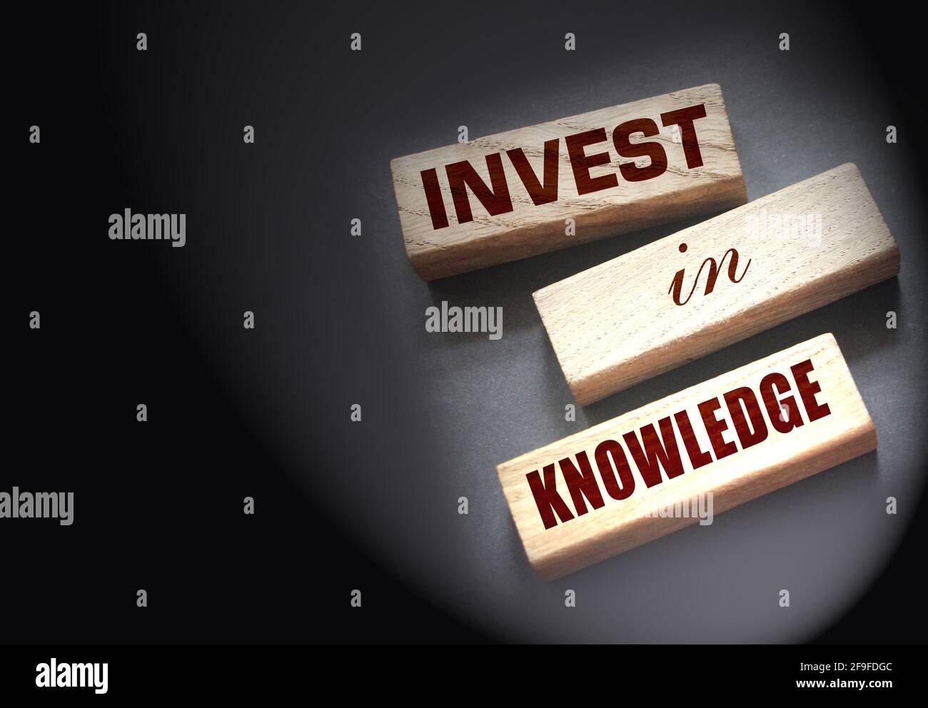 Invest in knowledge words onwooden blocks. Inspirational motivational ...