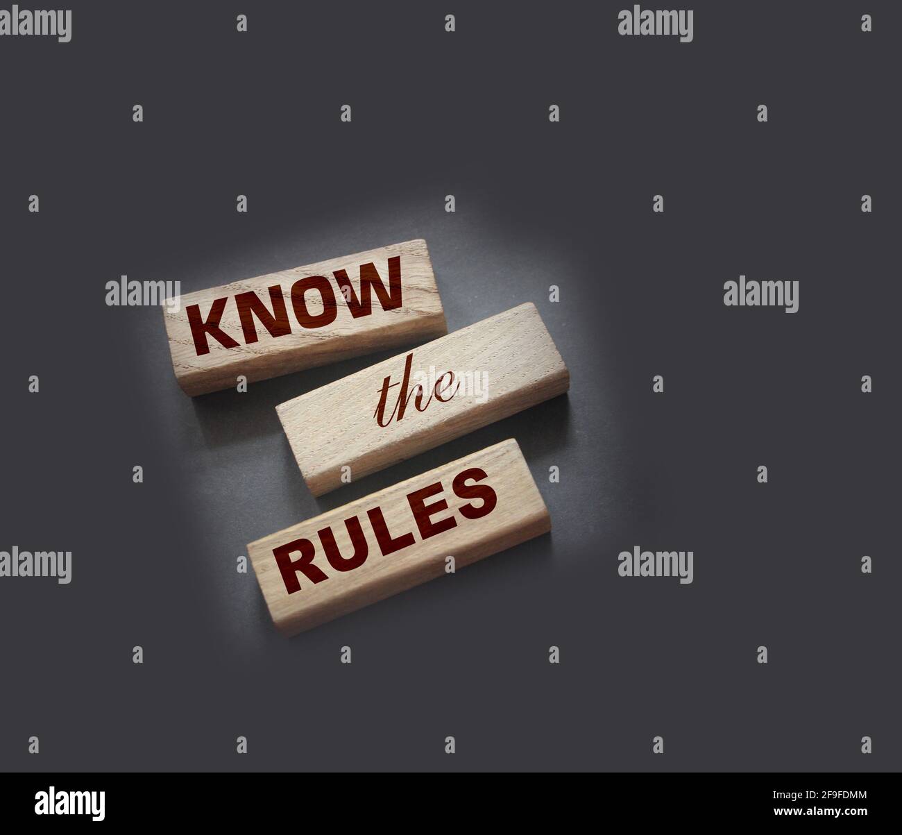 Know the rules word on wooden blocks isolated on dark grey background ...