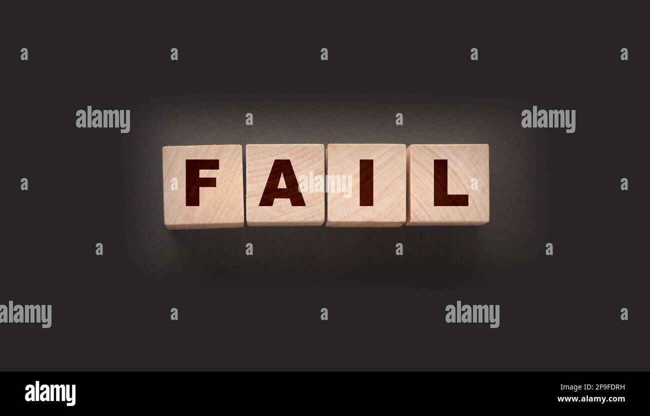 FAIL Word text Written In Wooden Cube blocks on black background ...