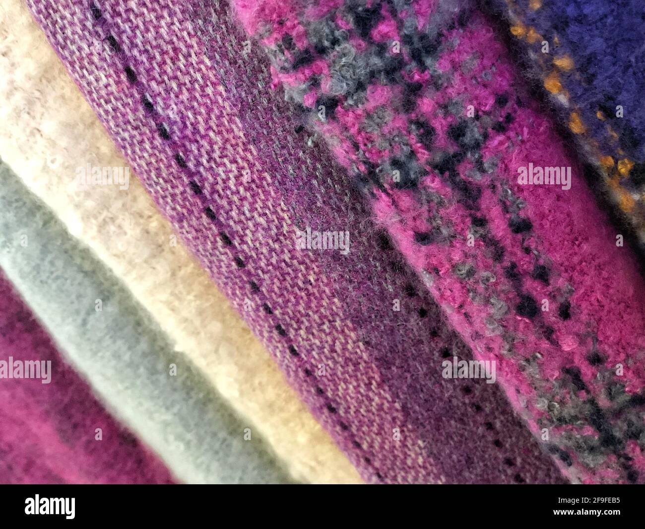 some colorful woven clothes as a background Stock Photo - Alamy
