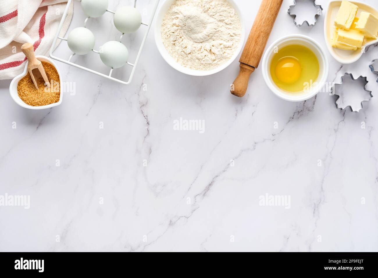 Baking background with flour, eggs, kitchen tools, utensils and cookie ...