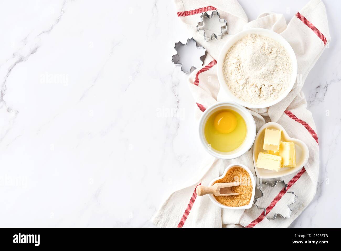 Baking background with flour, eggs, kitchen tools, utensils and cookie ...