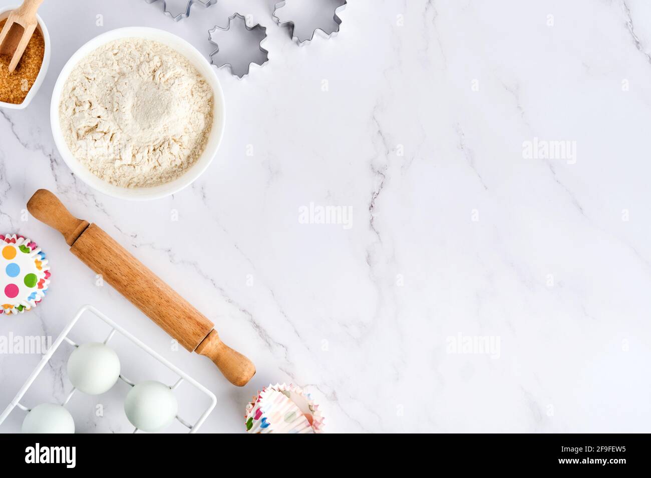 Baking background with flour, eggs, kitchen tools, utensils and cookie ...
