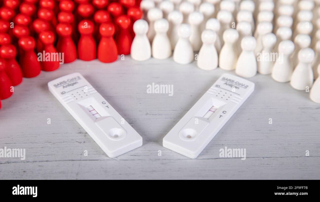 negative and positive corona antigen test in front of white and red ...