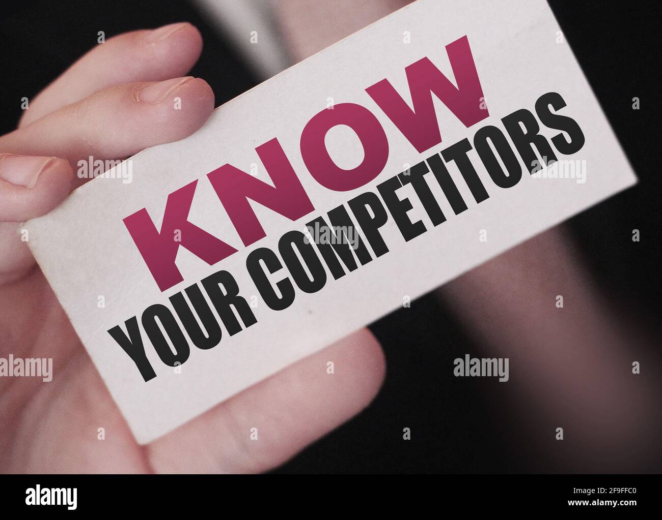 Businessman putting a card with text know your competitors. Business ...