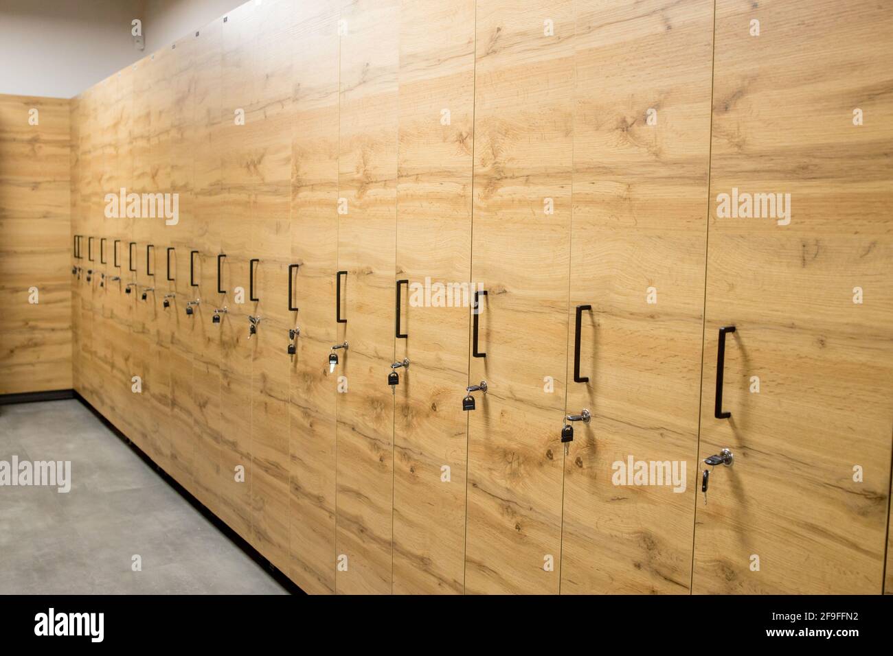 Wooden locker boxes, with metal locks. Classic wood locker room and a ...