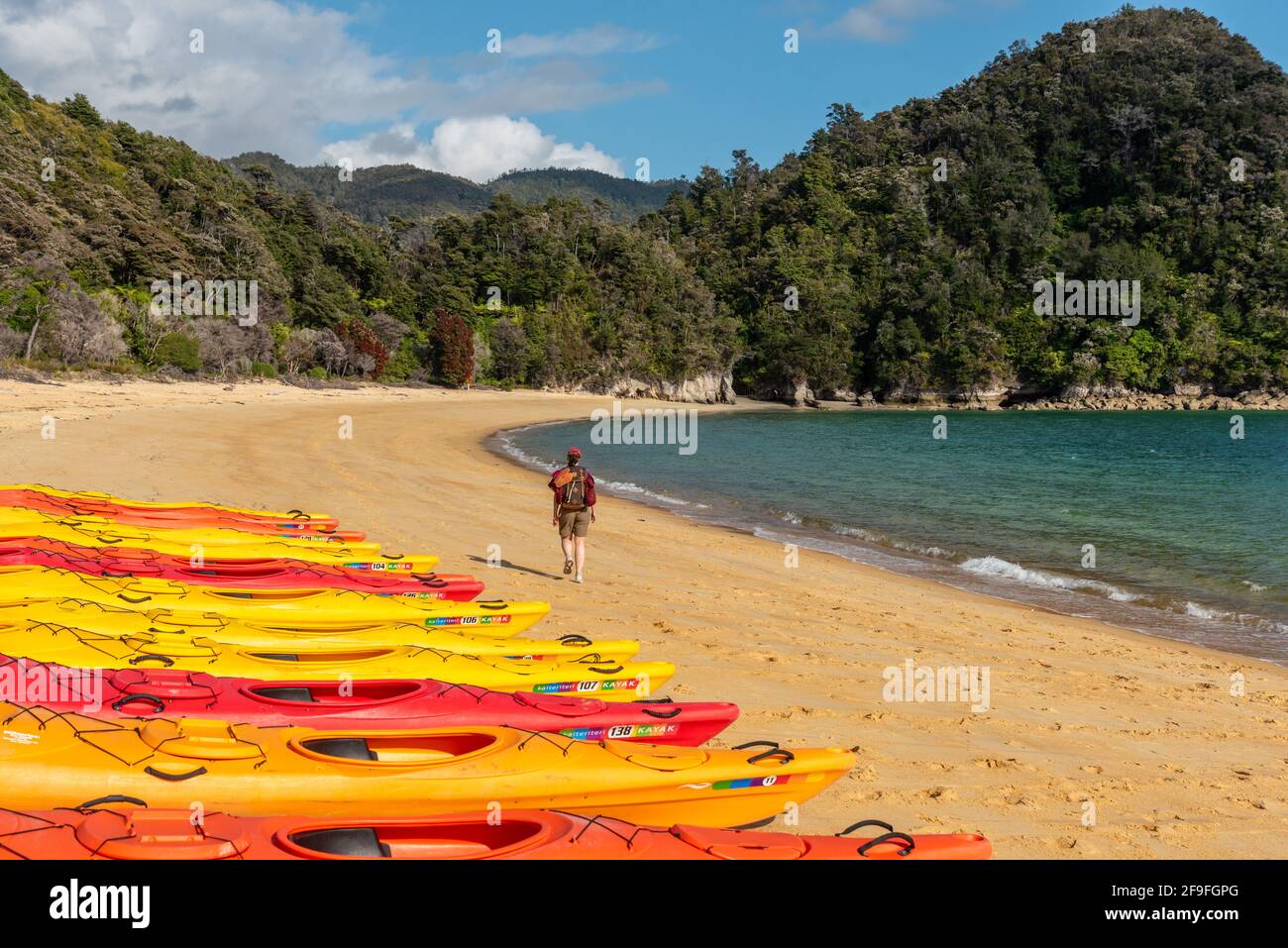 Kayaks laying at the beach of torrent bay of Abel Tasman National Park ...