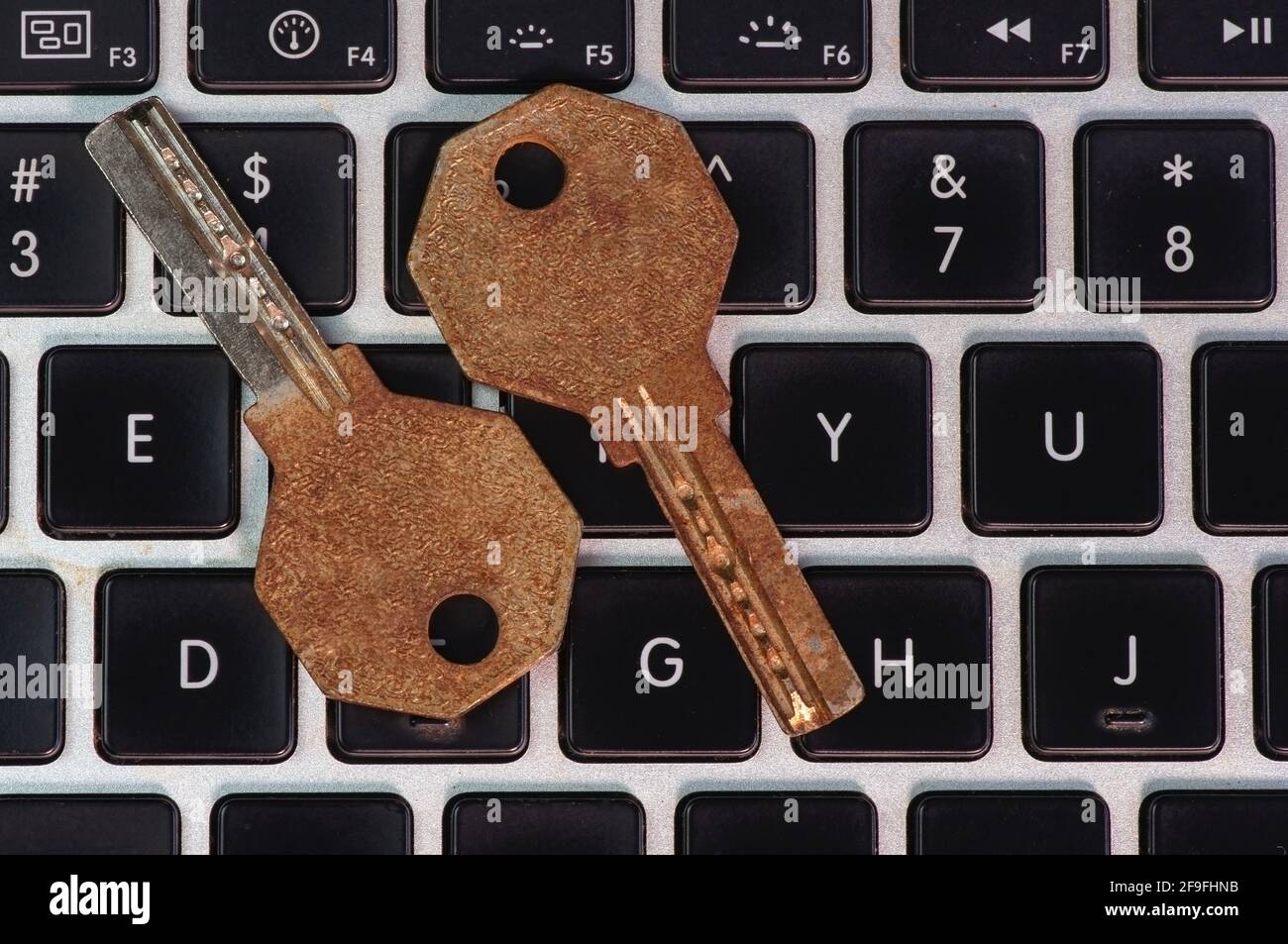 Old and rusty keys on laptop keyboard, computer security and password ...