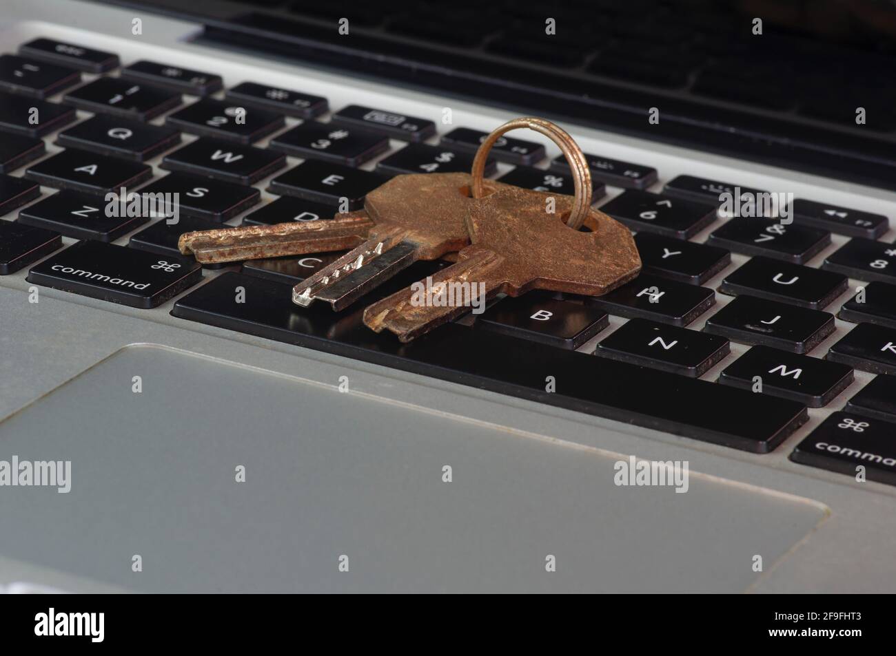 Old and rusty keys on laptop keyboard, computer security and password ...