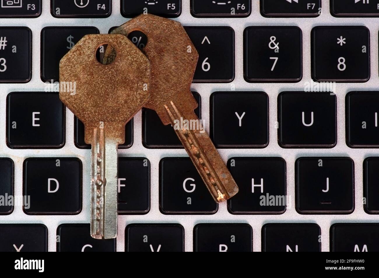 Old and rusty keys on laptop keyboard, computer security and password ...
