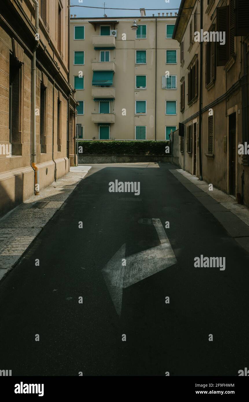 arrow sign painted on street Stock Photo - Alamy
