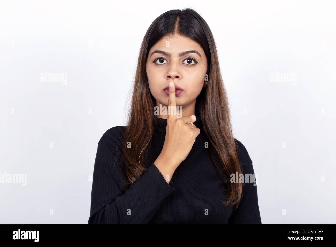 Finger on lips india hi-res stock photography and images - Alamy