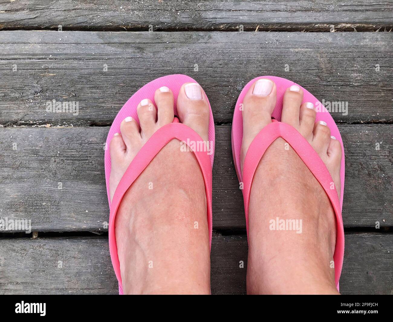 Woman wearing flip flops hi-res stock photography and images - Alamy