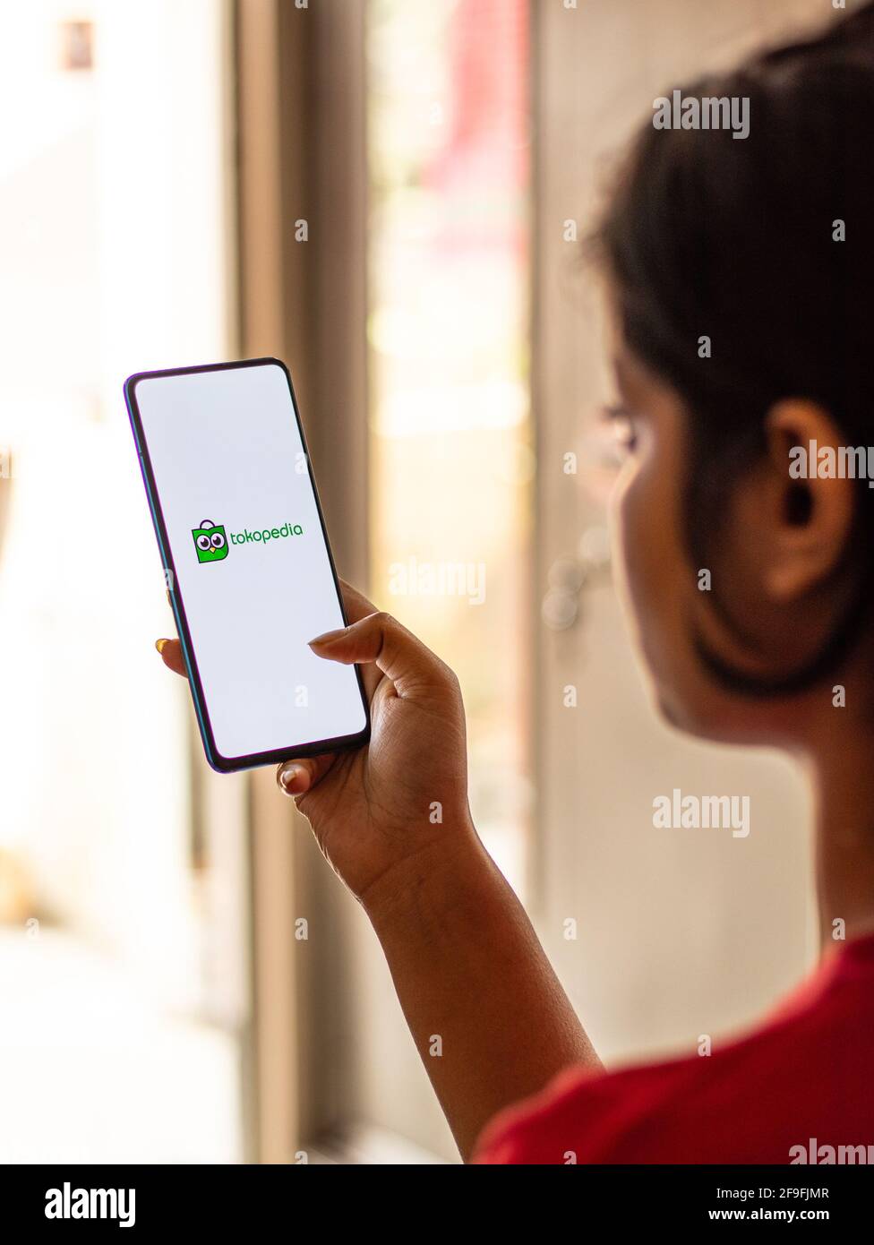 Assam, india - April 19, 2021 : Tokopedia logo on phone screen stock ...