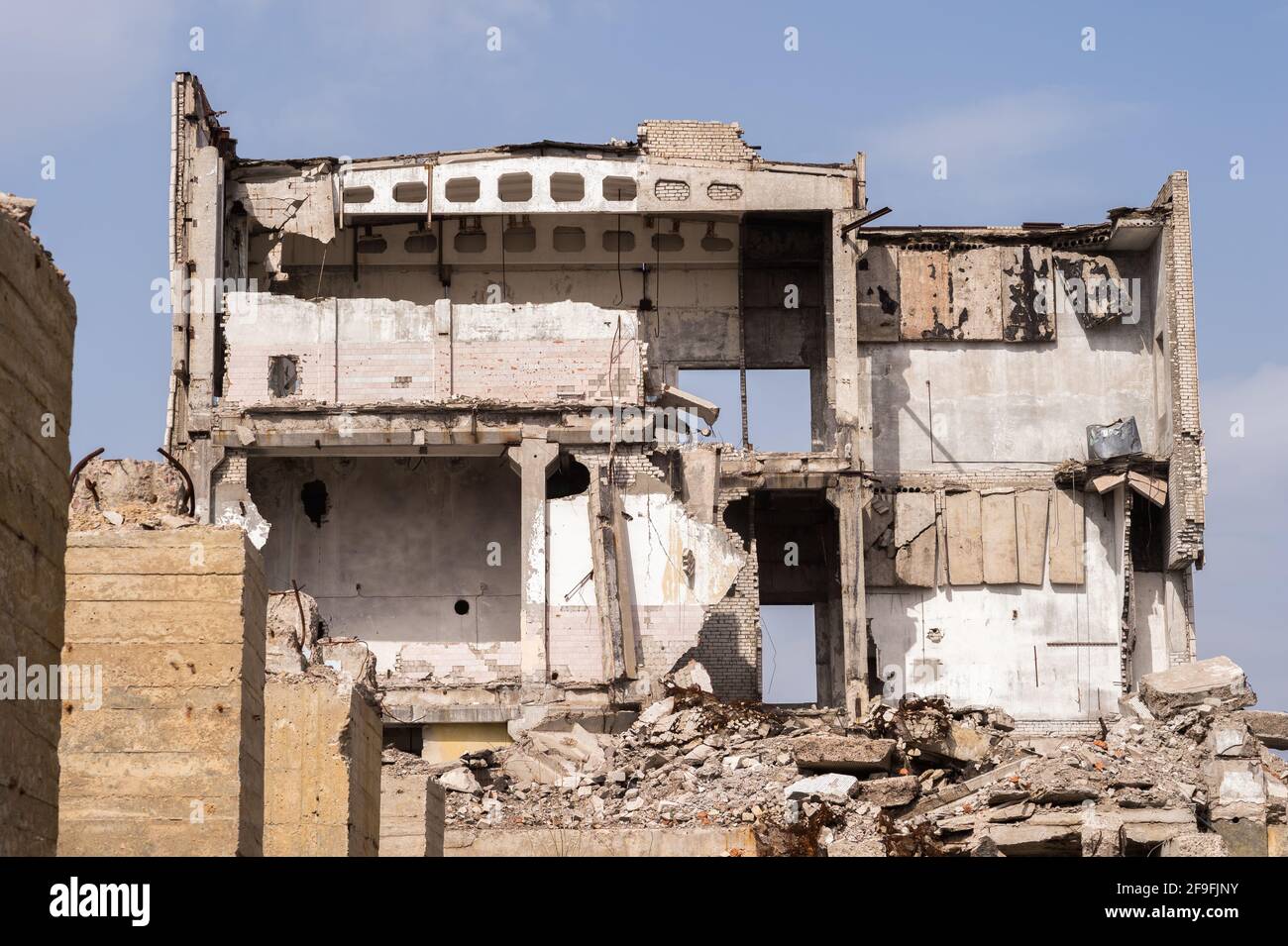 Piles of construction debris made of concrete rubble with large ...