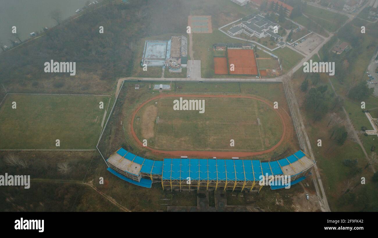An aerial shot of a football field captured on a foggy weather Stock ...