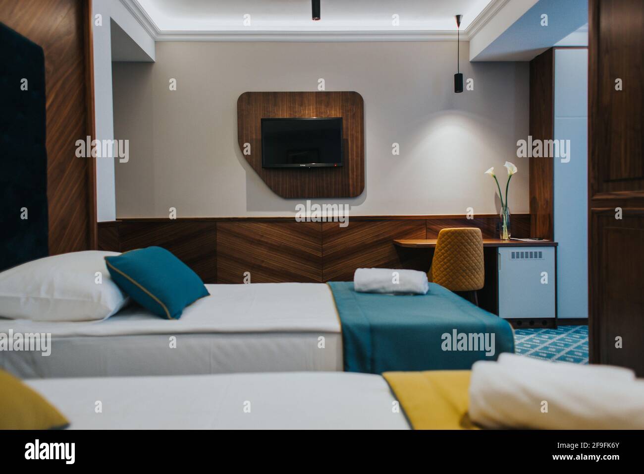 A view inside a modern bedroom in an apartment with rustic walls design ...