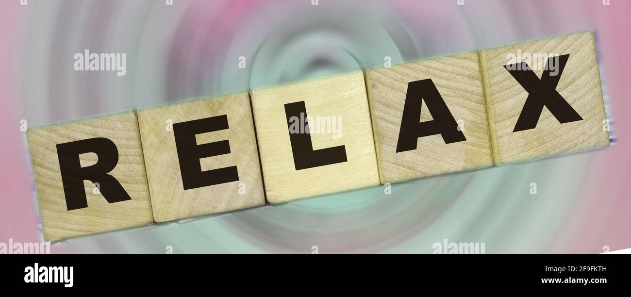 Relax - an inscription on wooden cube blocks on sunny beach beckground ...