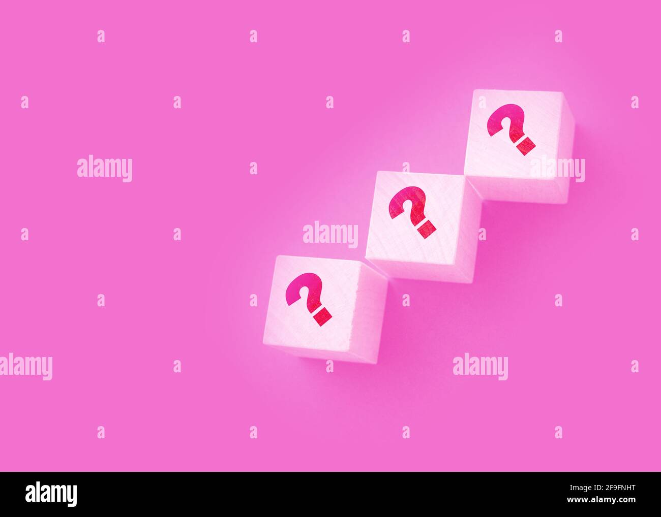 Three wooden blocks with black question marks. Faq questions and ...