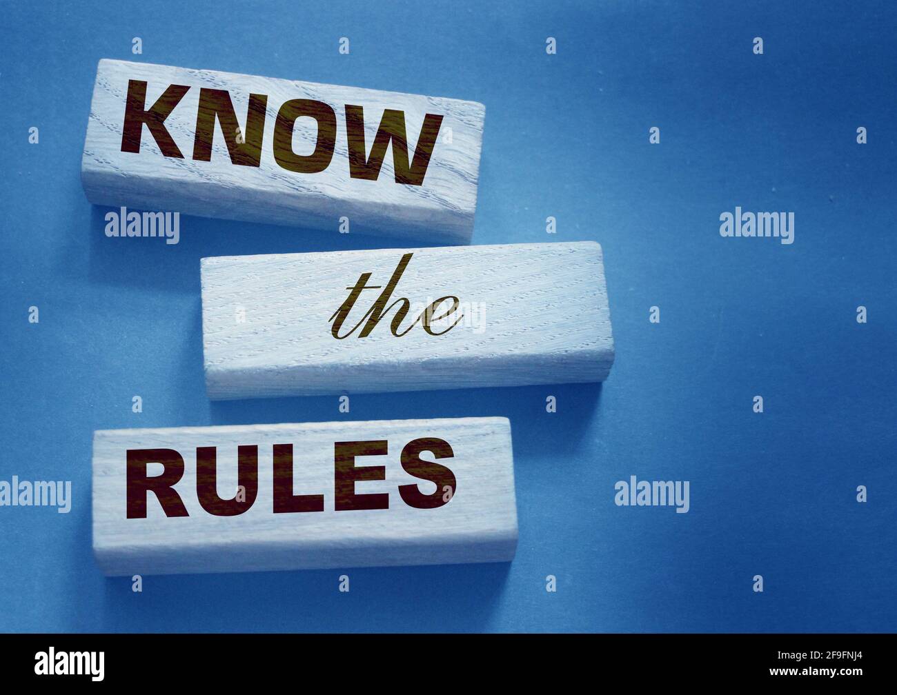 Know the rules word on wooden blocks isolated on dark grey background ...
