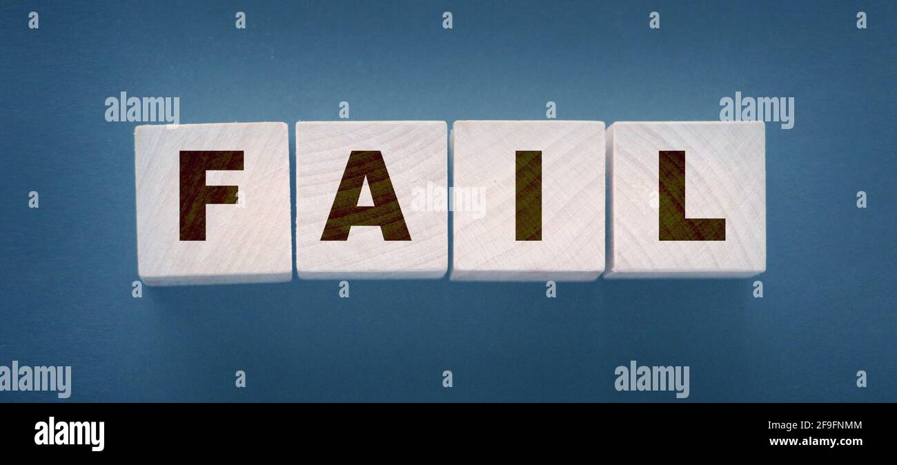 FAIL Word text Written In Wooden Cube blocks on black background ...