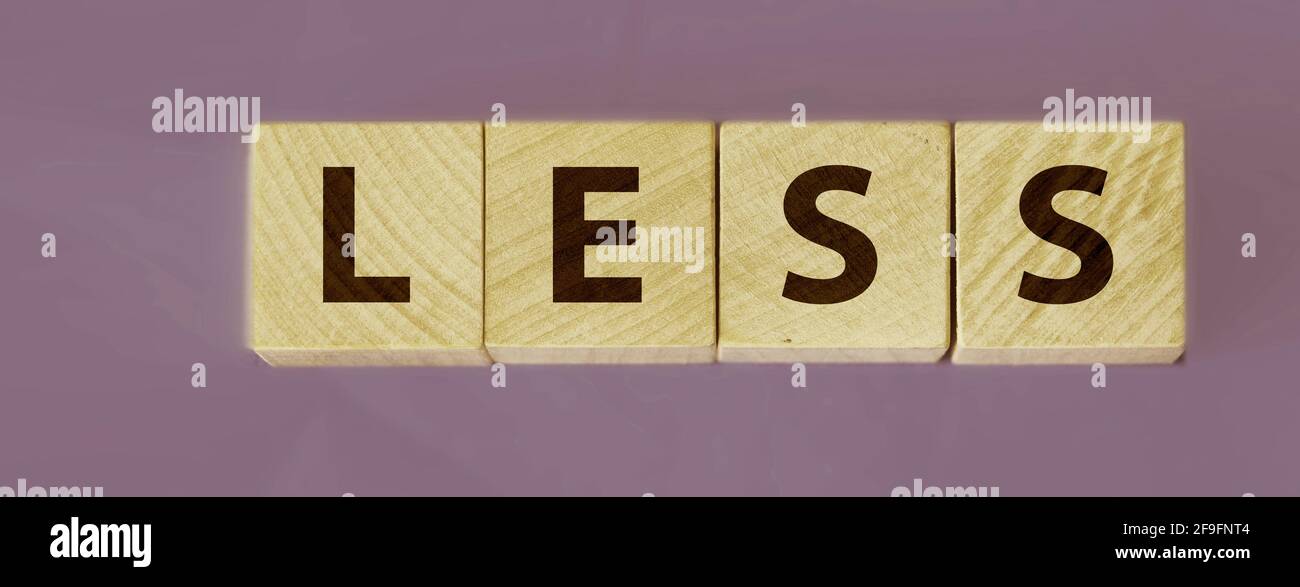 Less word on wooden cubic blocks with letters. Spend less or cut costs ...