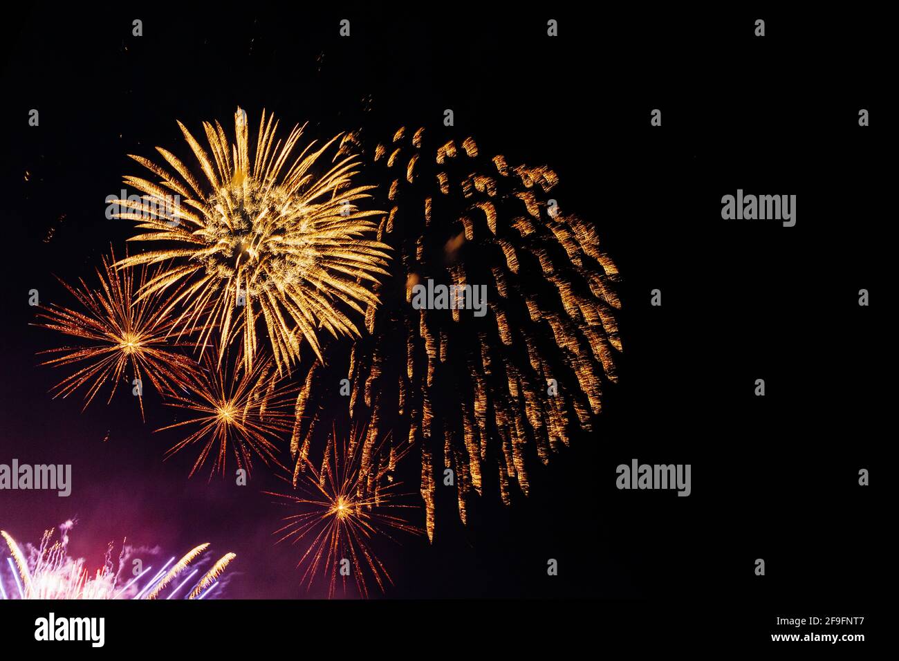 A low angle shot of bright fireworks at night - great for wallpapers ...