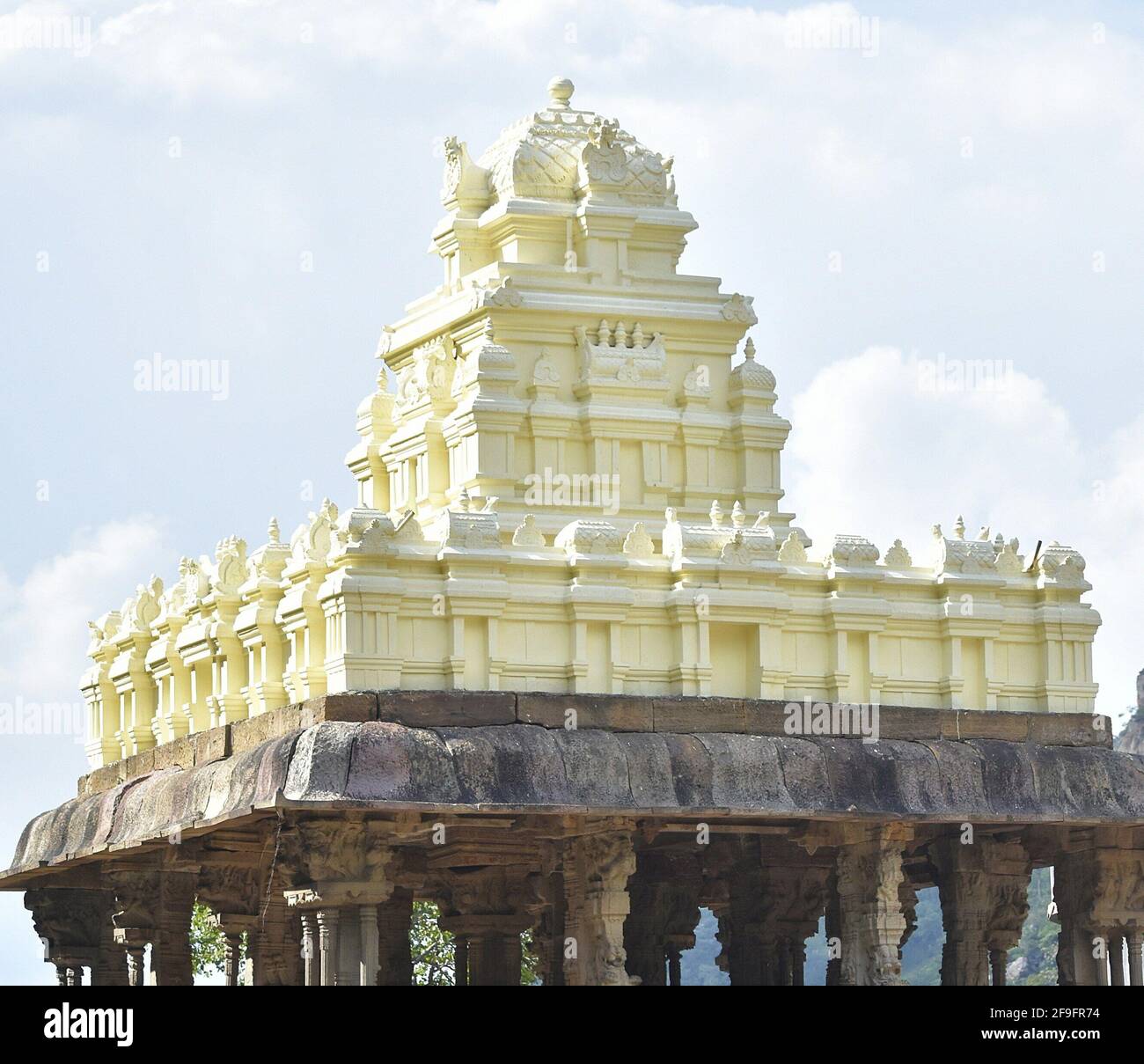 A beautiful shot of a Hindu temple on a stone during a cloudy weather ...