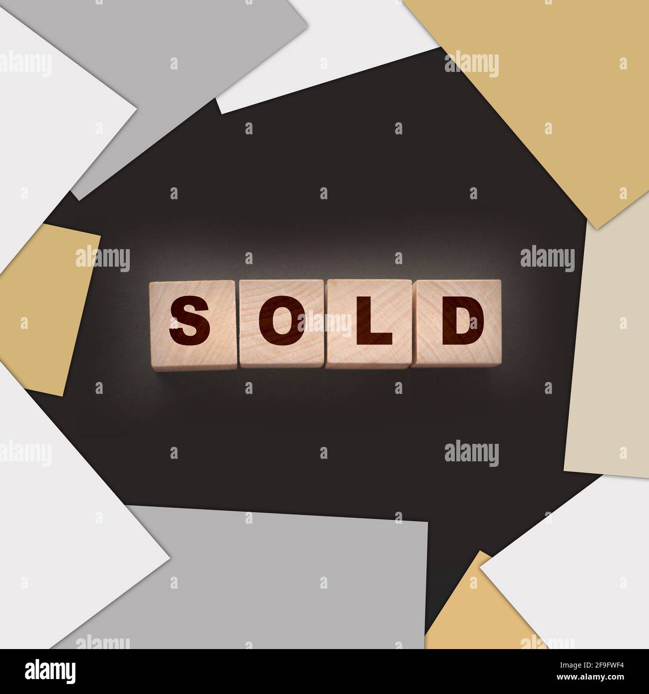 Sold Word Written In Wooden Cubes on black background. Real estate ...